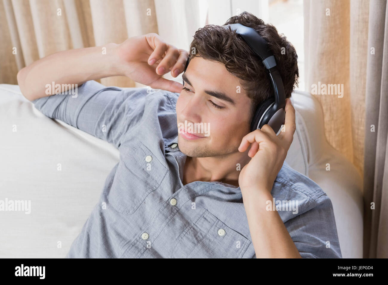 Handsome brunette man relaxing on hi-res stock photography and images ...