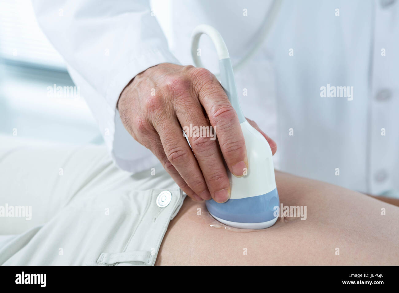 Pregnant woman undergoing ultrasound test Stock Photo - Alamy