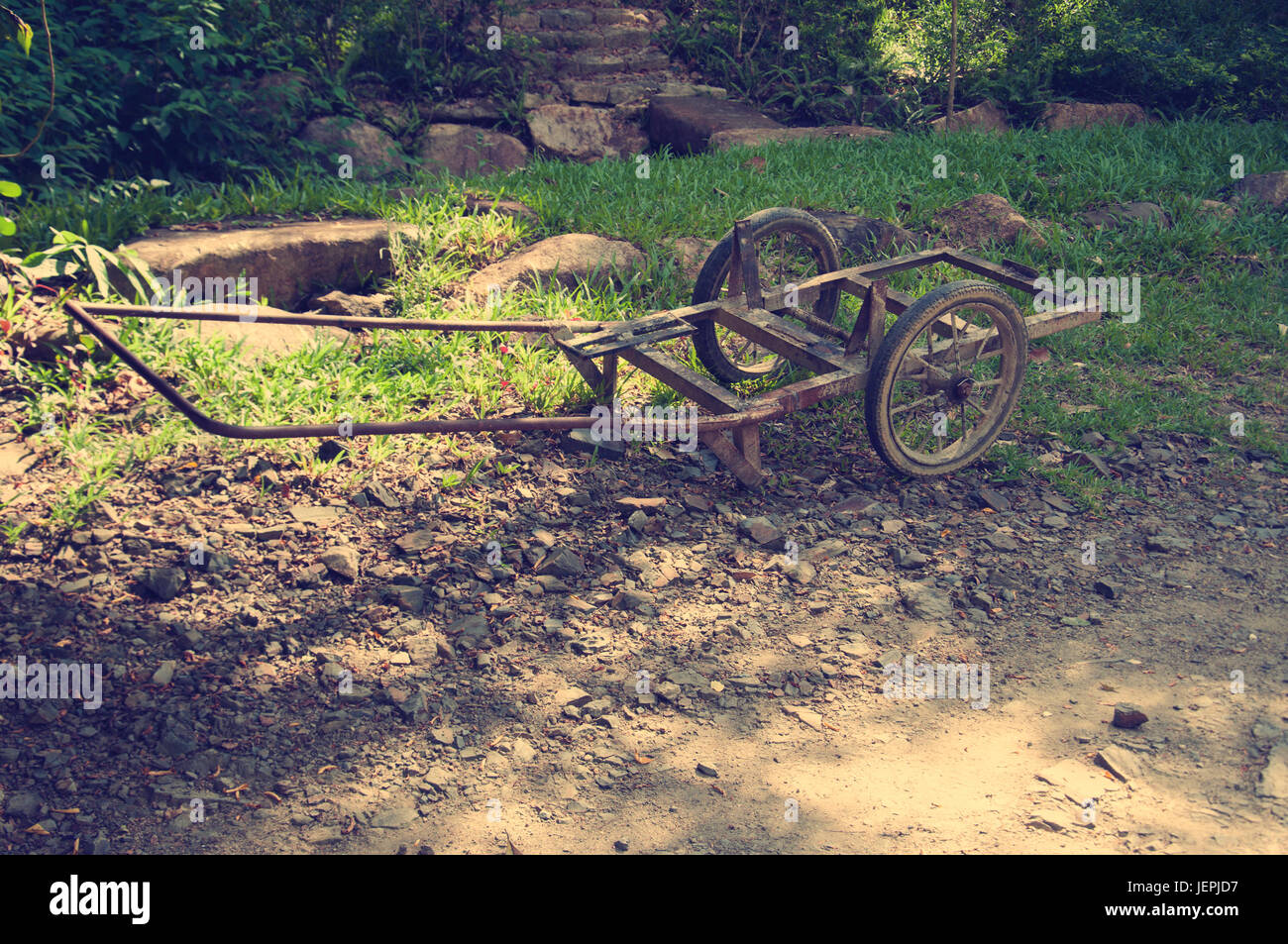 An old broken cart standing on a path. Asia. Vietnam. Toning Stock ...