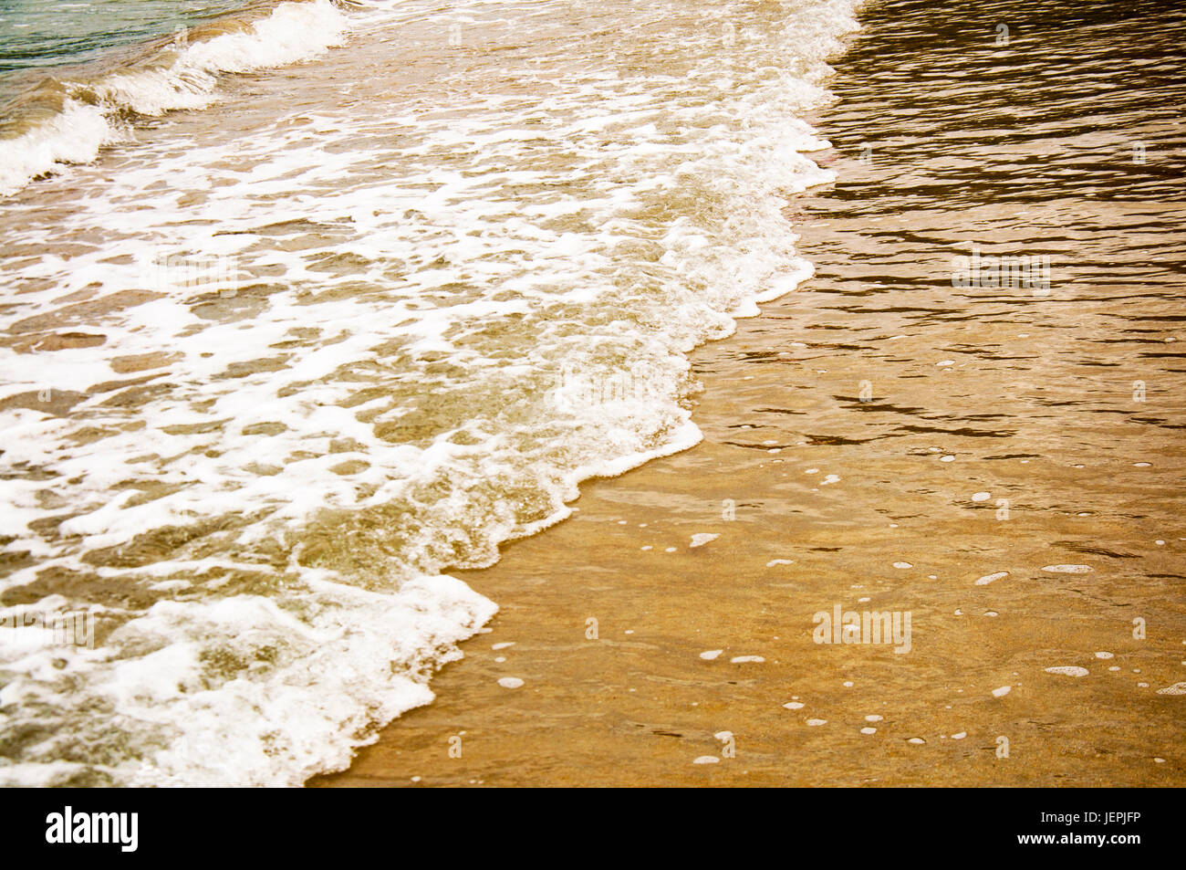 Soft wave of blue ocean on a sandy beach. With the blur. Toning Stock ...