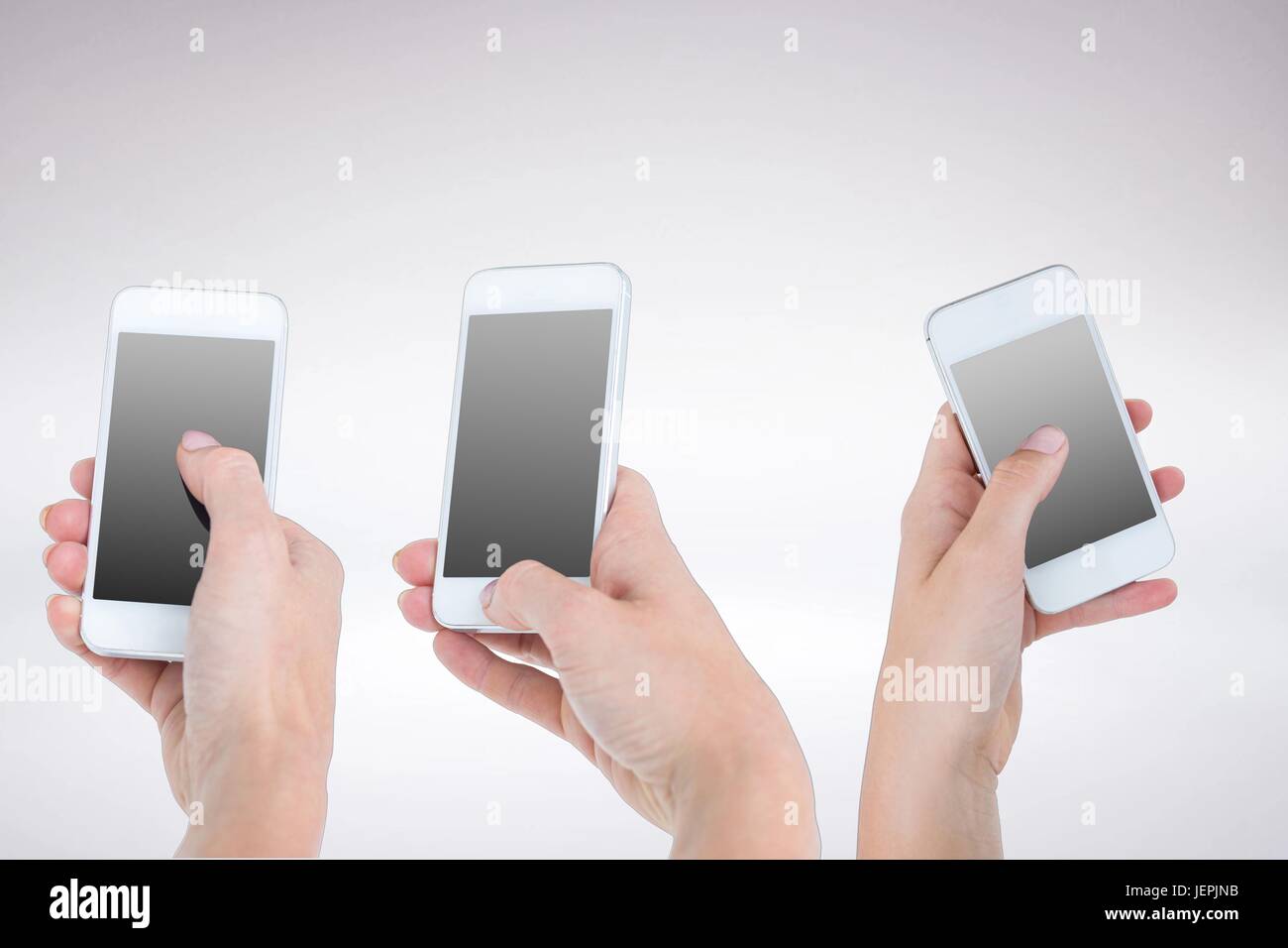 Hands holding smartphones hi-res stock photography and images - Alamy