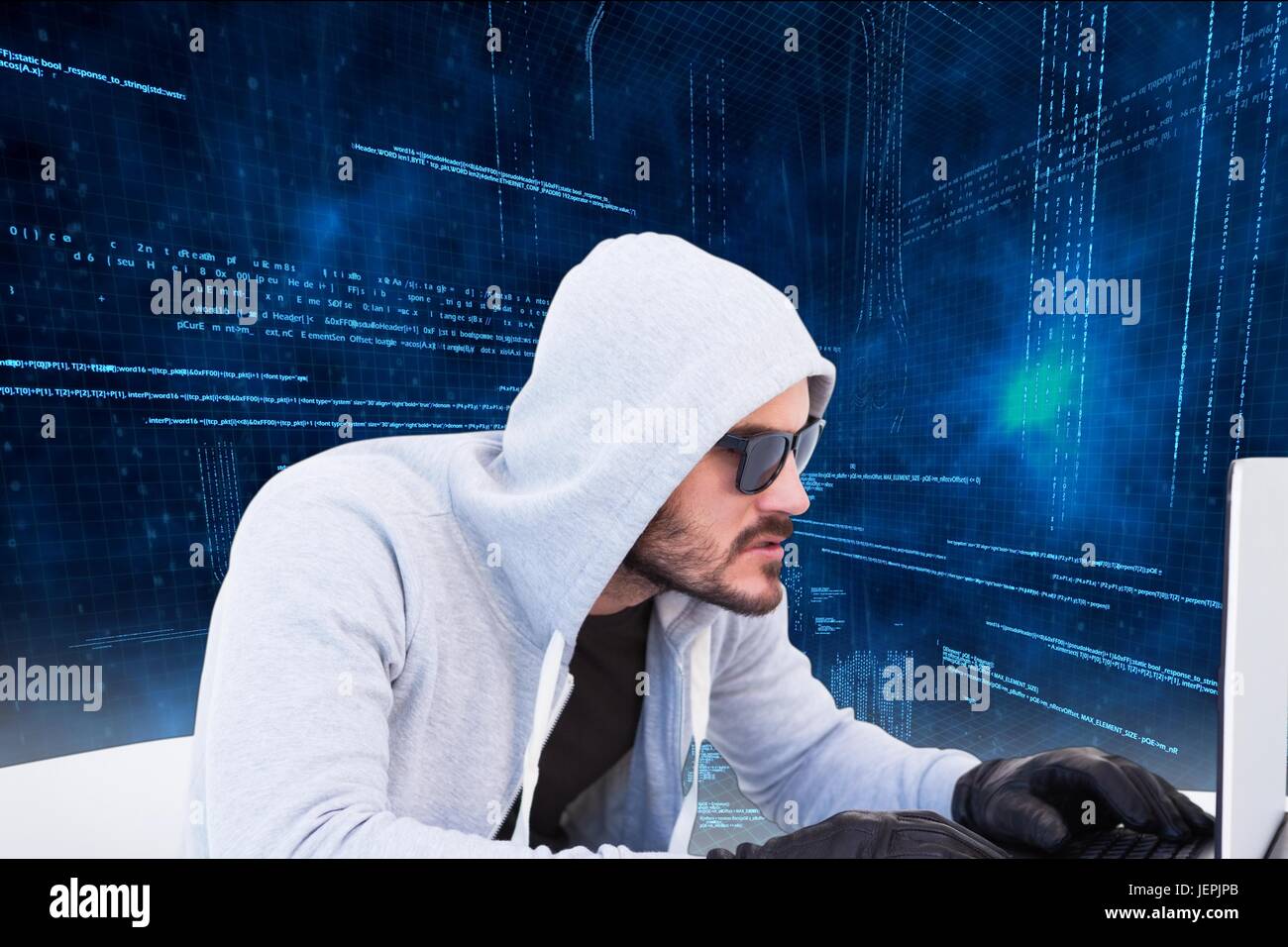 Suspicious man on laptop Stock Photo - Alamy