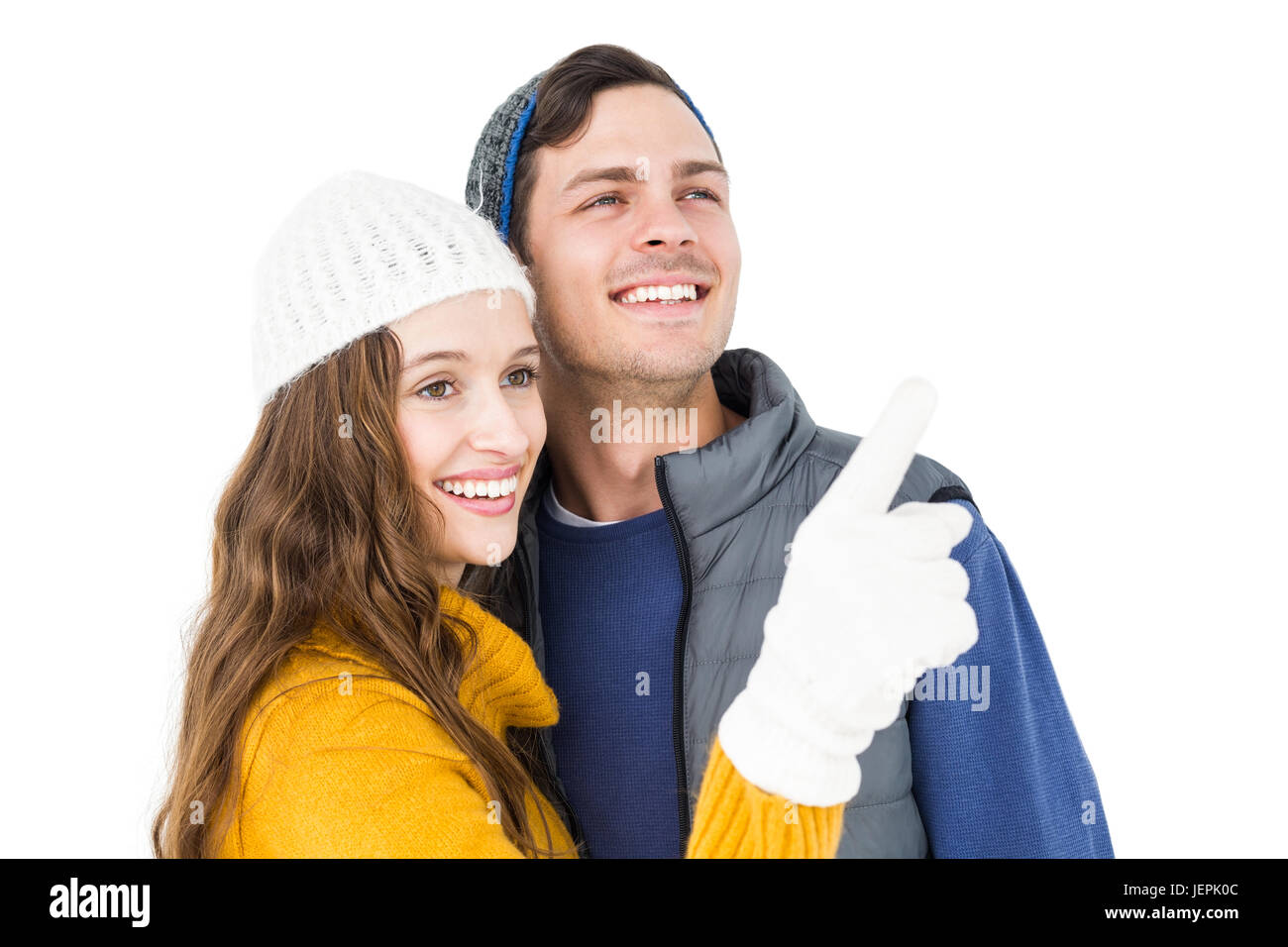 Smiling couple pointing and looking away Stock Photo - Alamy