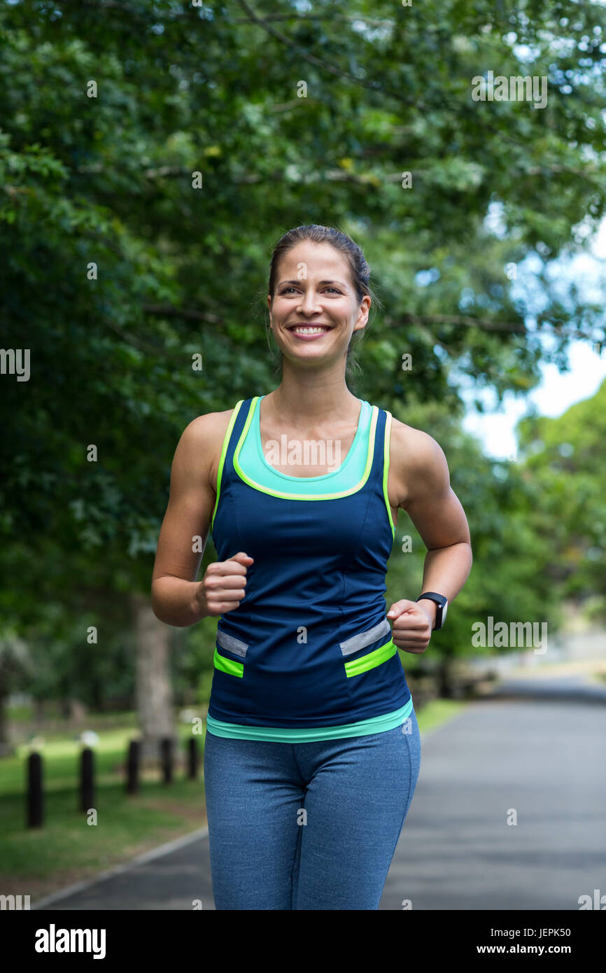 Marathon female athlete running Stock Photo - Alamy