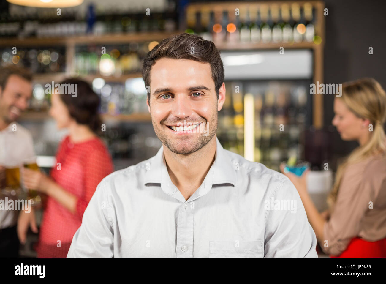 Young man smiling at camera Stock Photo - Alamy