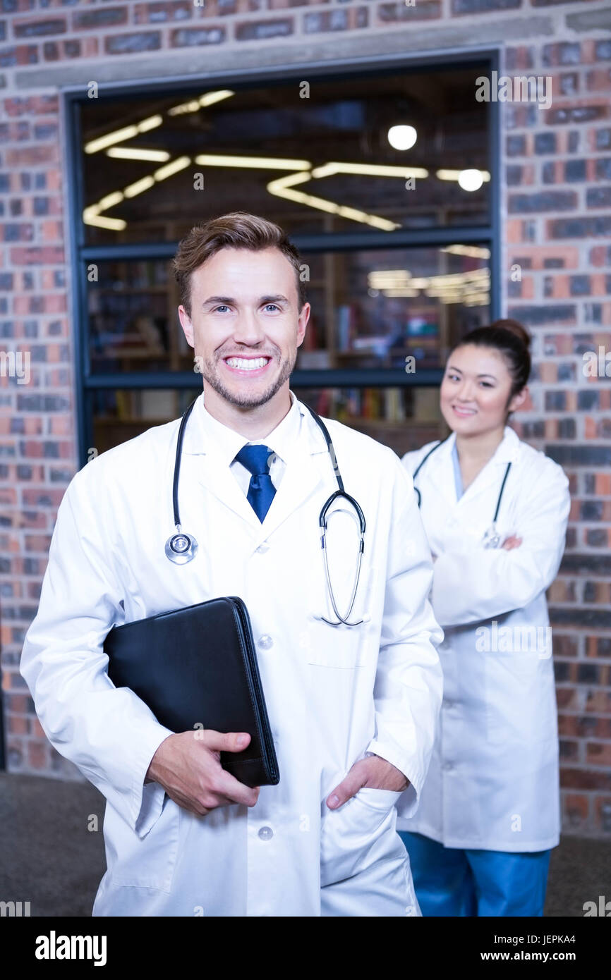 Doctors looking at camera and smiling Stock Photo - Alamy