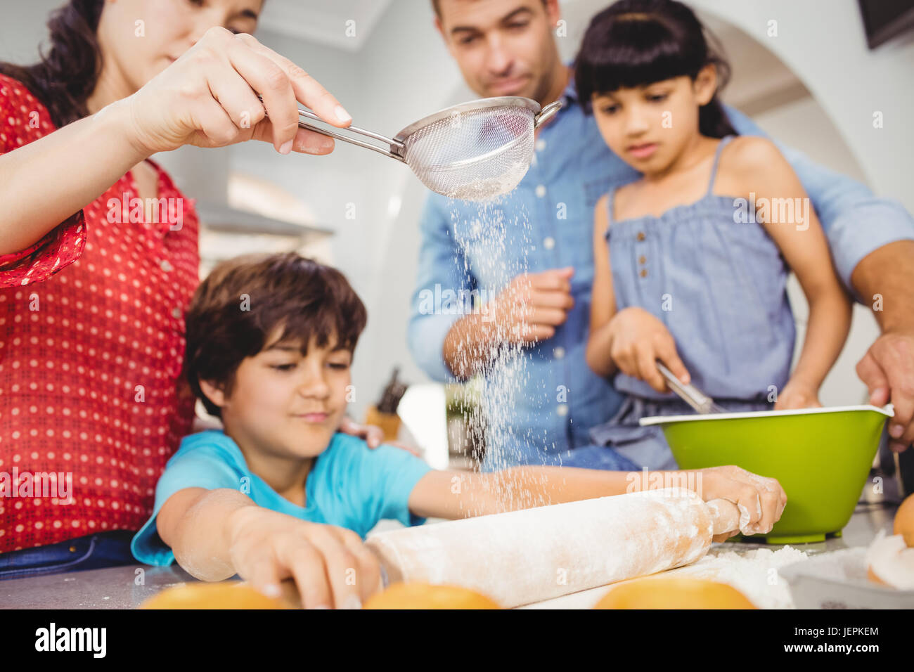 Family preparing food at home Stock Photo - Alamy