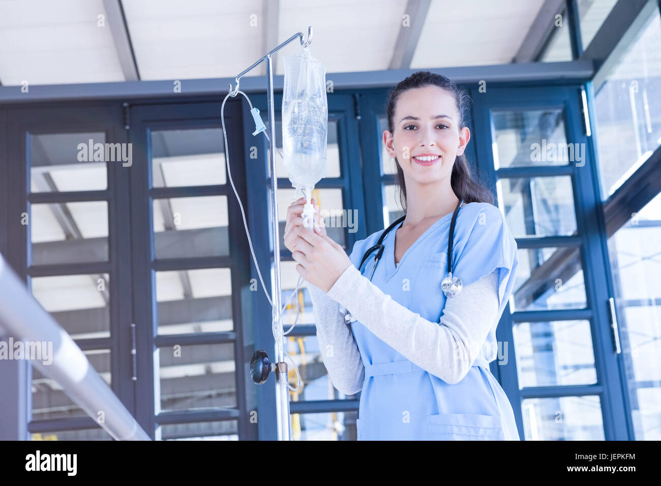 Doctor holding intravenous drip Stock Photo - Alamy Doctor holding intravenous drip Stock Photo - Alamy