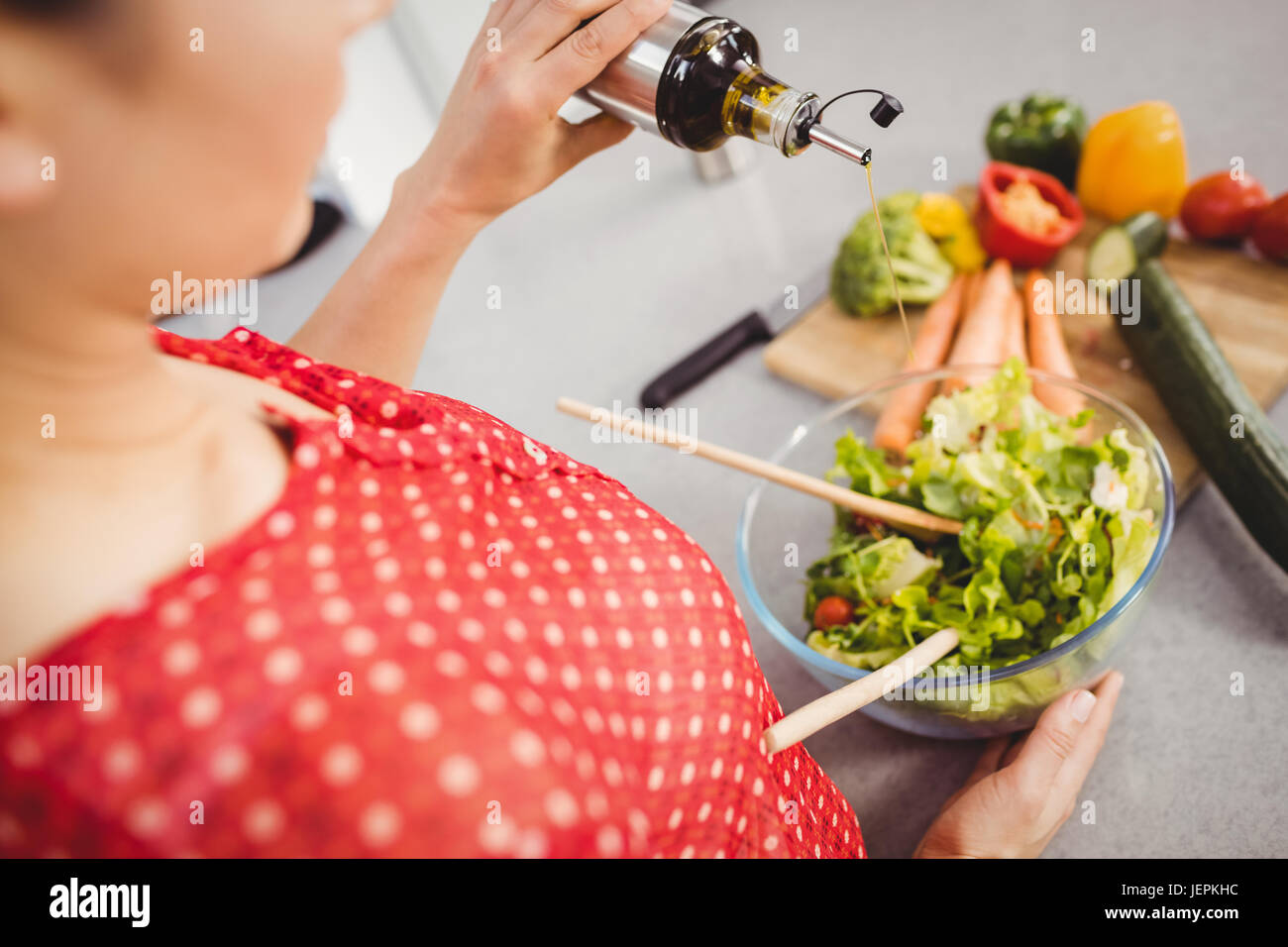 Woman adding oil hi-res stock photography and images - Alamy