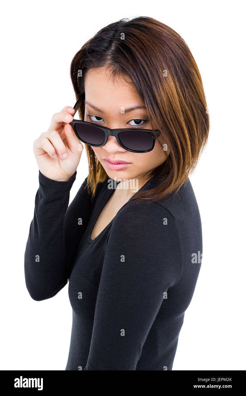 Woman looking over her sunglasses Stock Photo - Alamy
