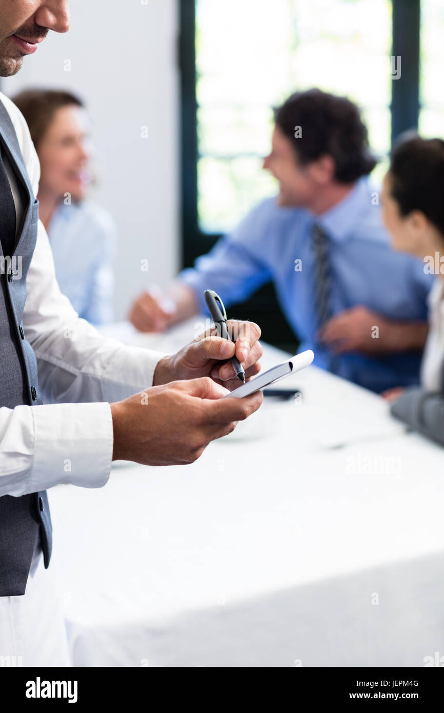 Female waiter taking order hi-res stock photography and images - Alamy