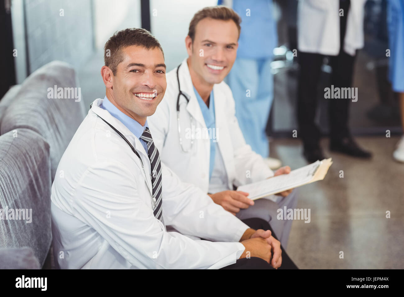 Portrait two partners holding hi-res stock photography and images - Alamy