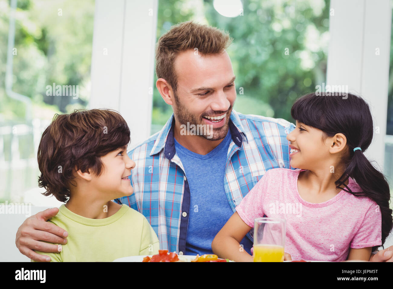 Smiling father and children Stock Photo - Alamy