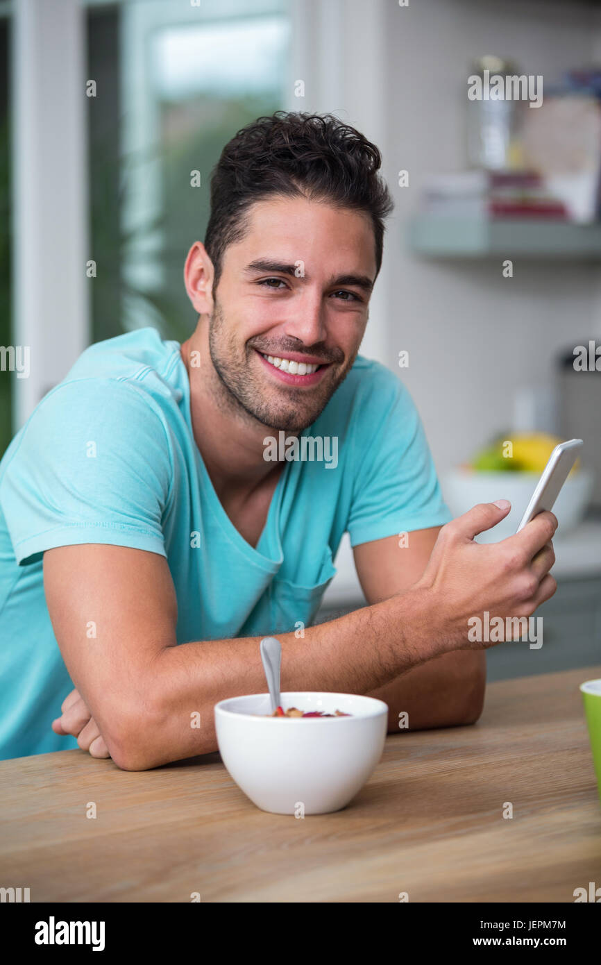 Portrait of cheerful man using phone Stock Photo - Alamy