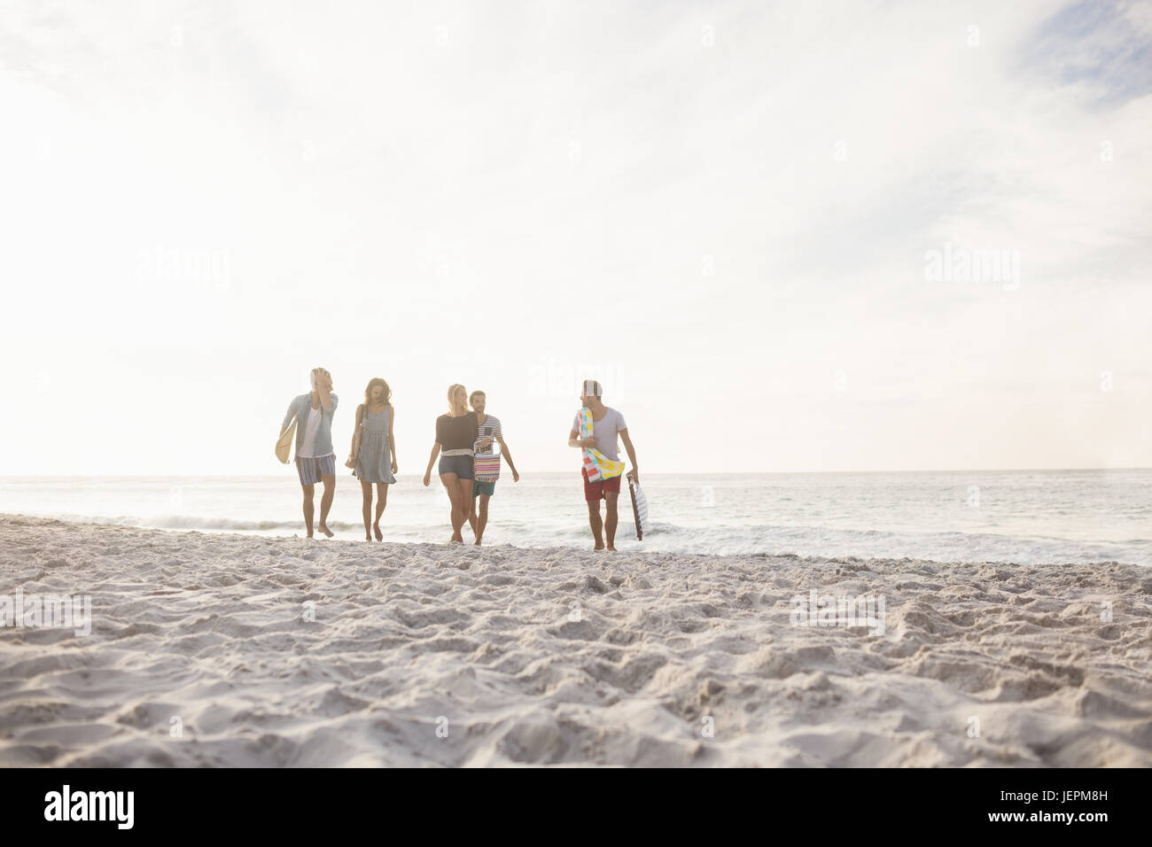 Happy friends bringing their stuff Stock Photo - Alamy
