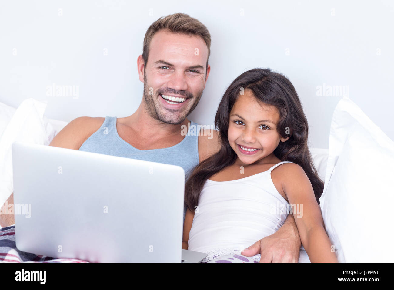 Father and daughter using laptop Stock Photo - Alamy