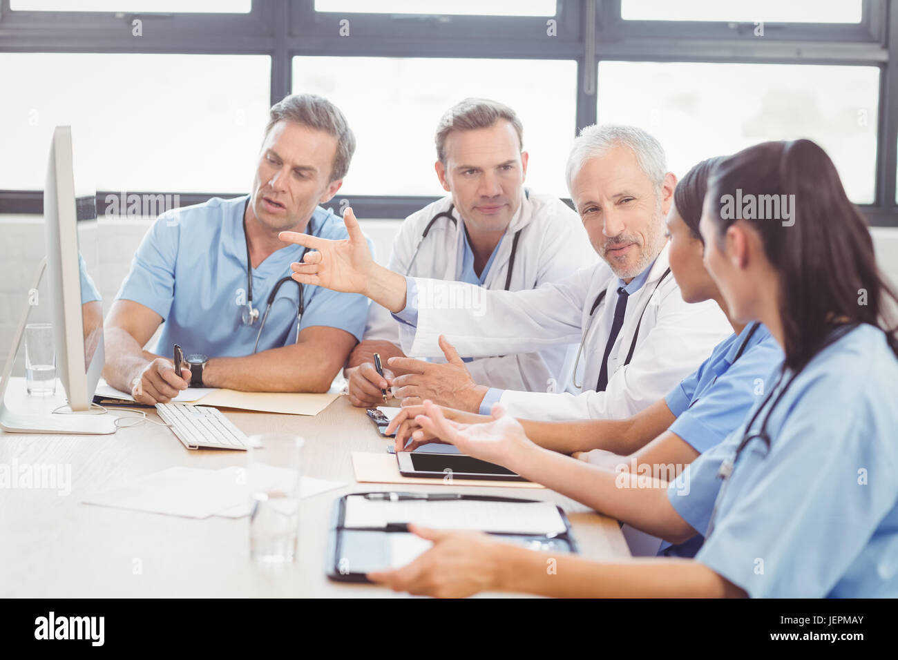 Medical team interacting in conference room Stock Photo - Alamy