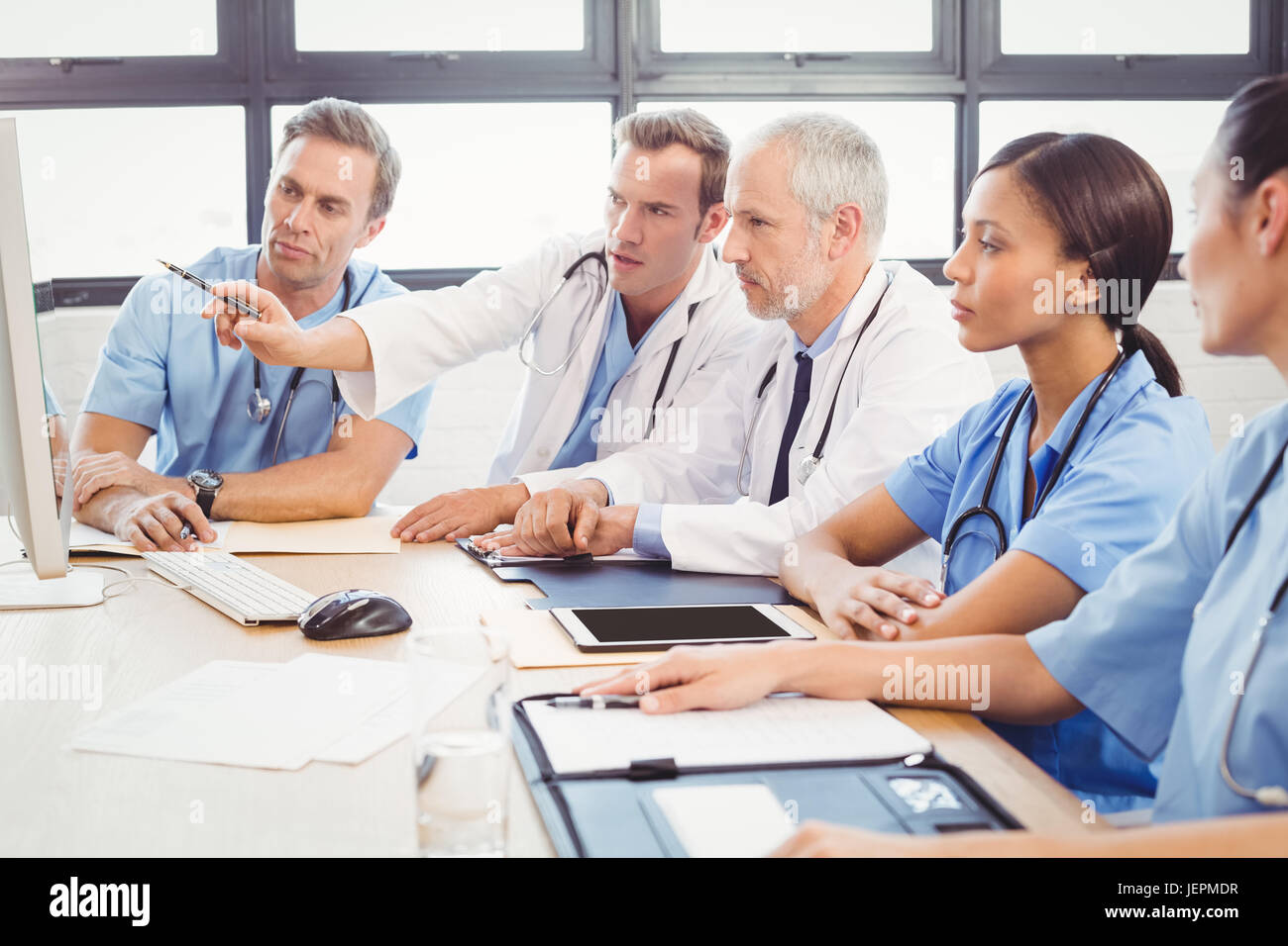 Medical team interacting in conference room Stock Photo - Alamy