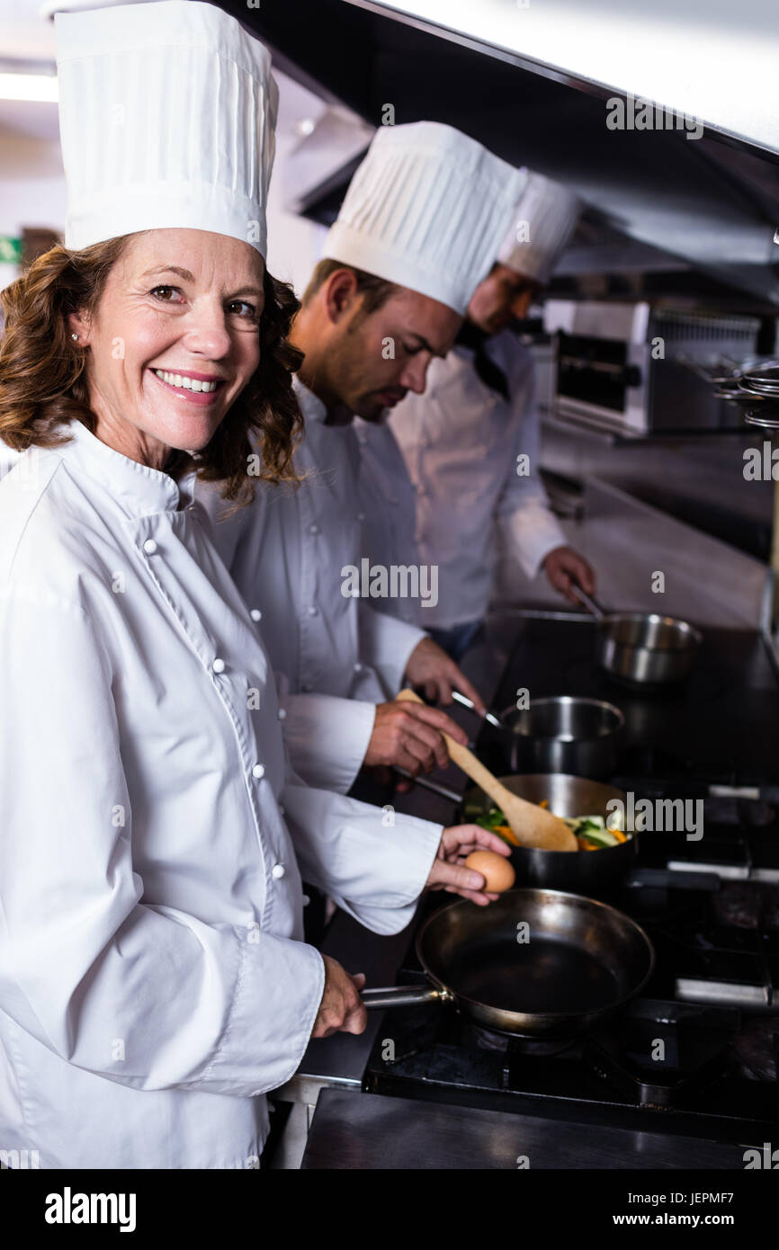 Chef preparing egg in the kitchen Stock Photo - Alamy