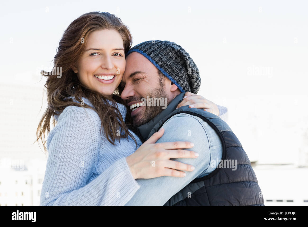 Happy couple cuddling each other Stock Photo - Alamy