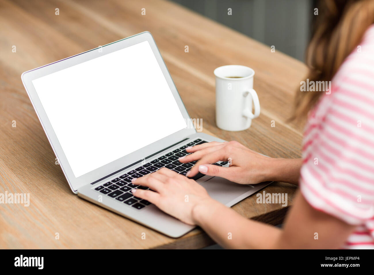 Cropped image of woman typing in laptop Stock Photo - Alamy