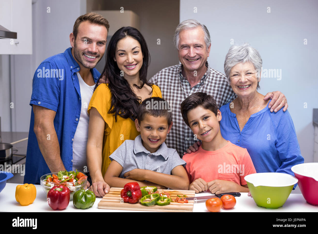 Happy family in the kitchen Stock Photo - Alamy