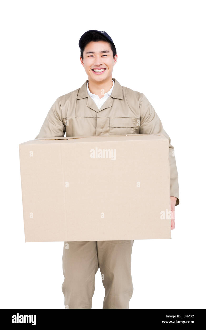 Delivery man holding cardboard box Stock Photo - Alamy
