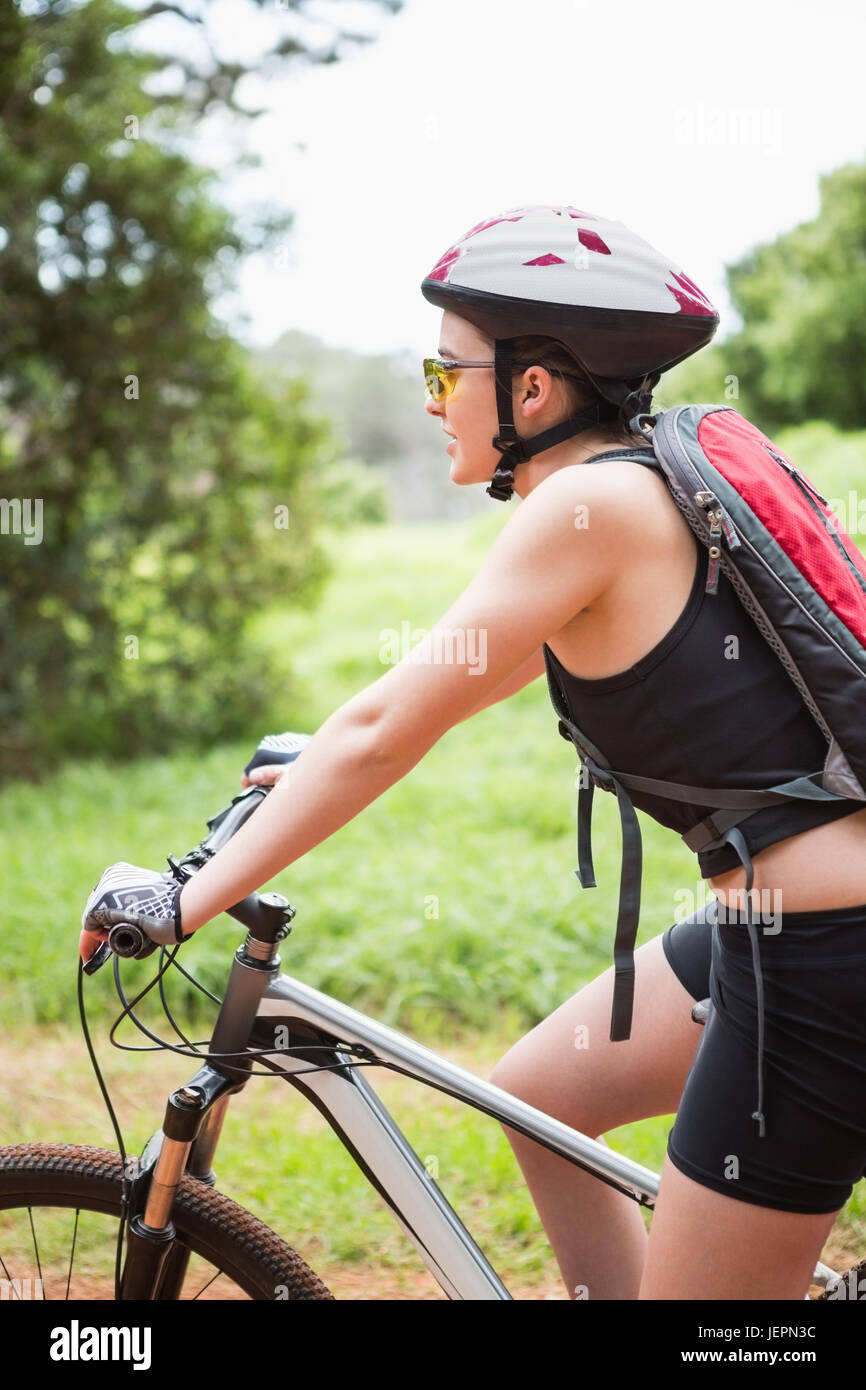 Woman riding her bike Stock Photo - Alamy