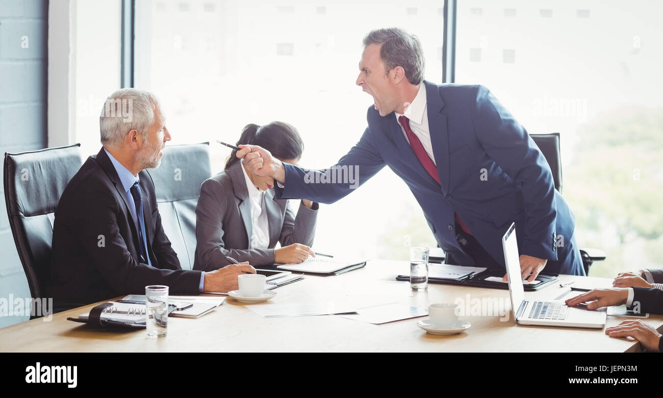Businessman scolding mixed race business hi-res stock photography and ...