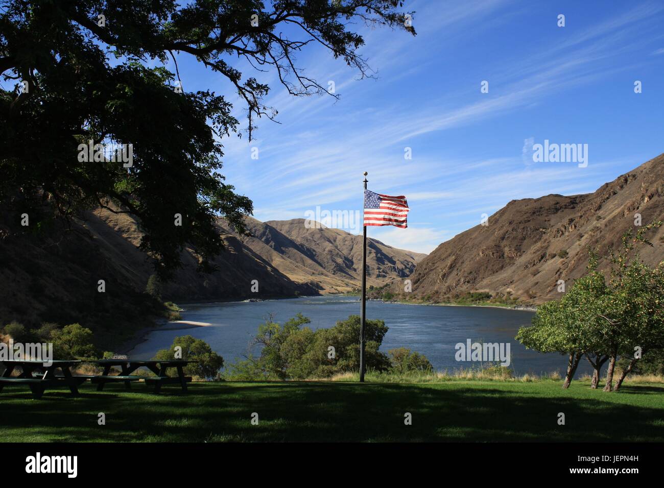 American Flag Waving Over Water Stock Photo - Alamy