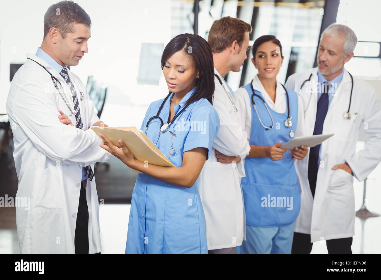 Colleagues interacting other using hi-res stock photography and images - Alamy