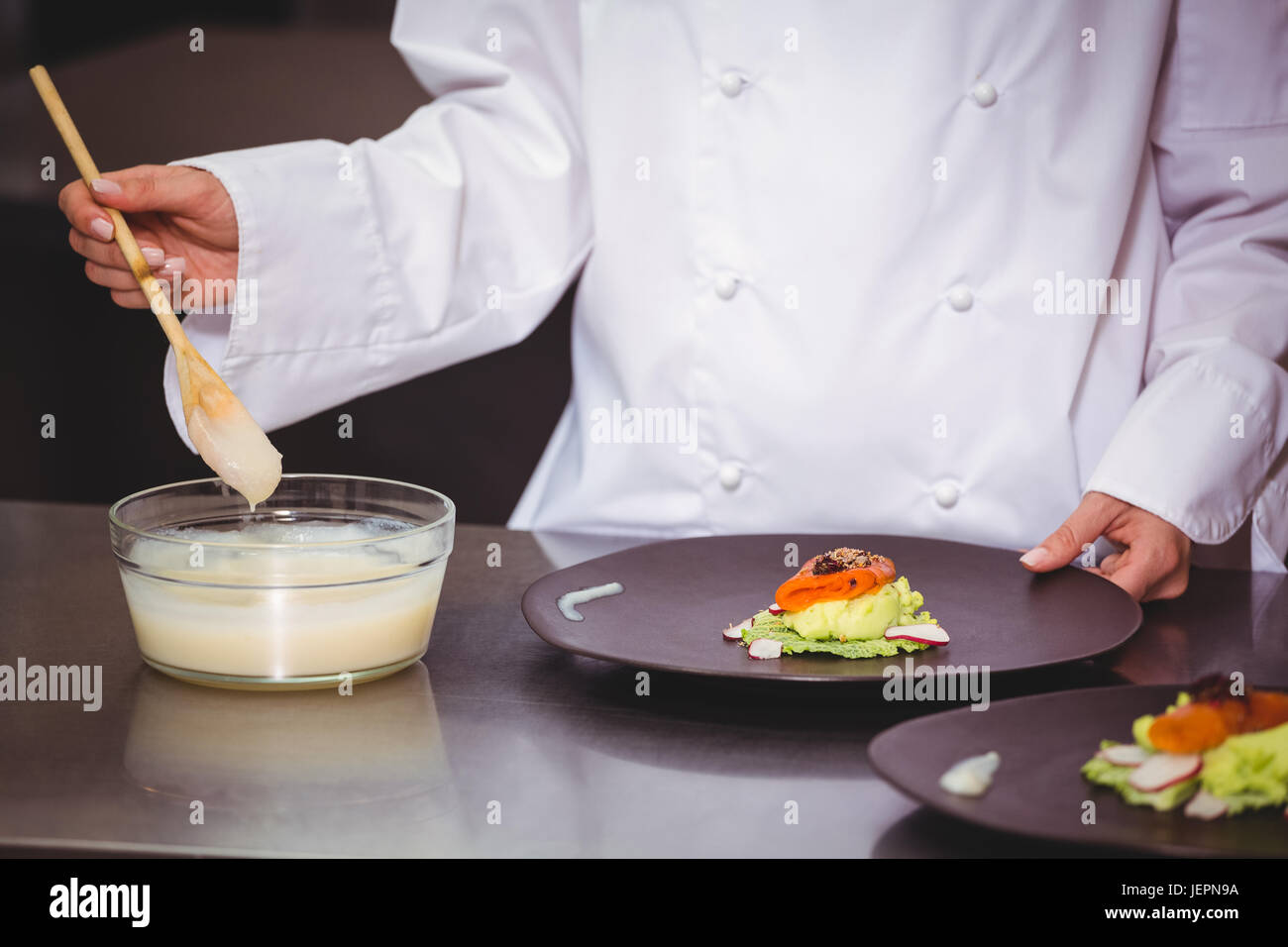 Professional chef adding sauce hi-res stock photography and images - Alamy