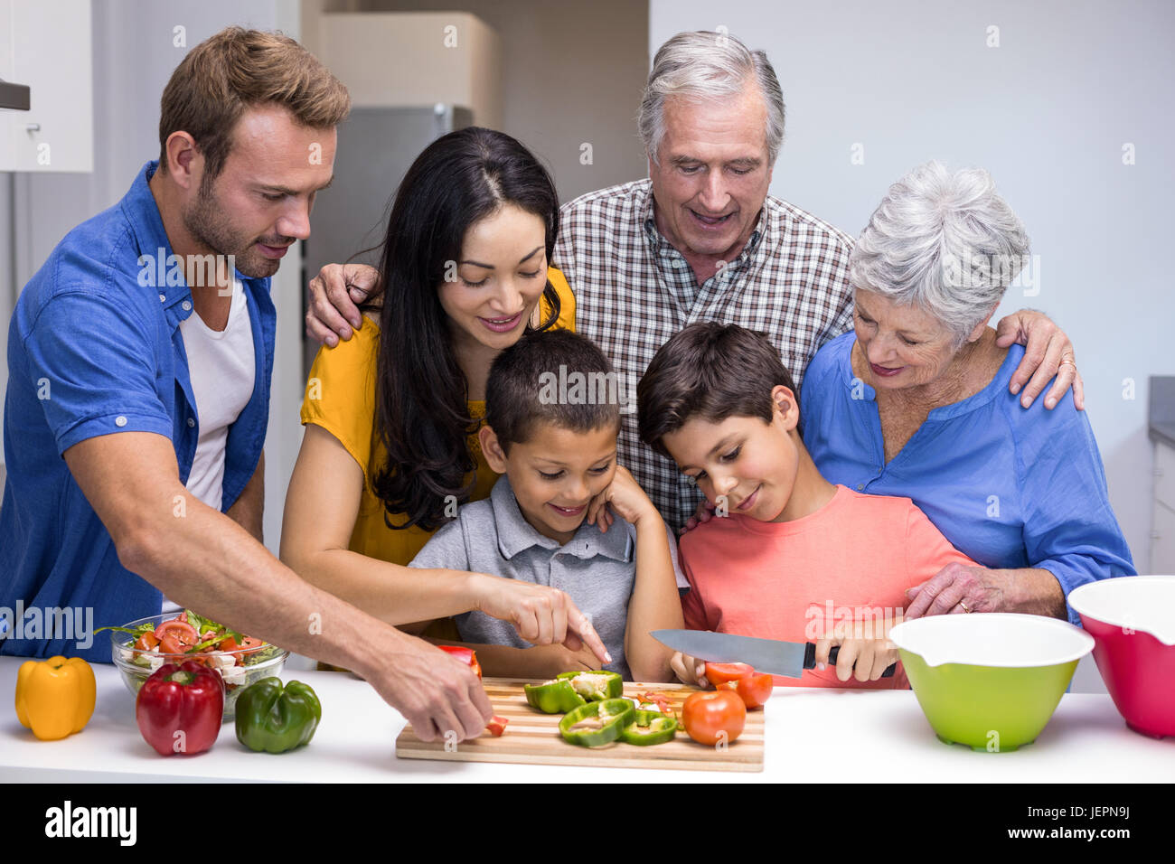 Happy family in the kitchen Stock Photo - Alamy
