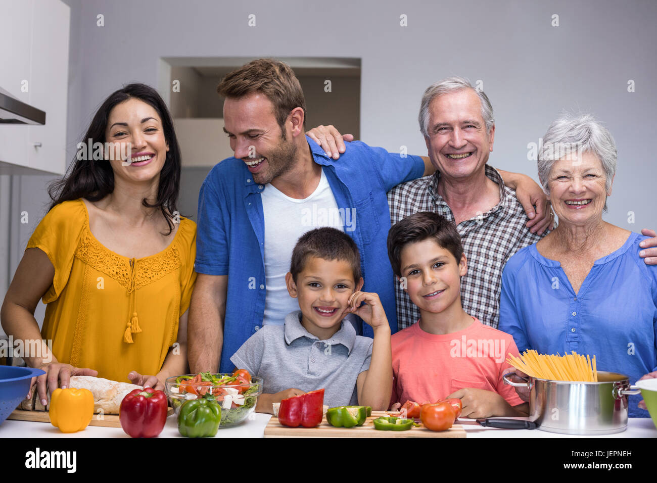 Happy family in the kitchen Stock Photo - Alamy