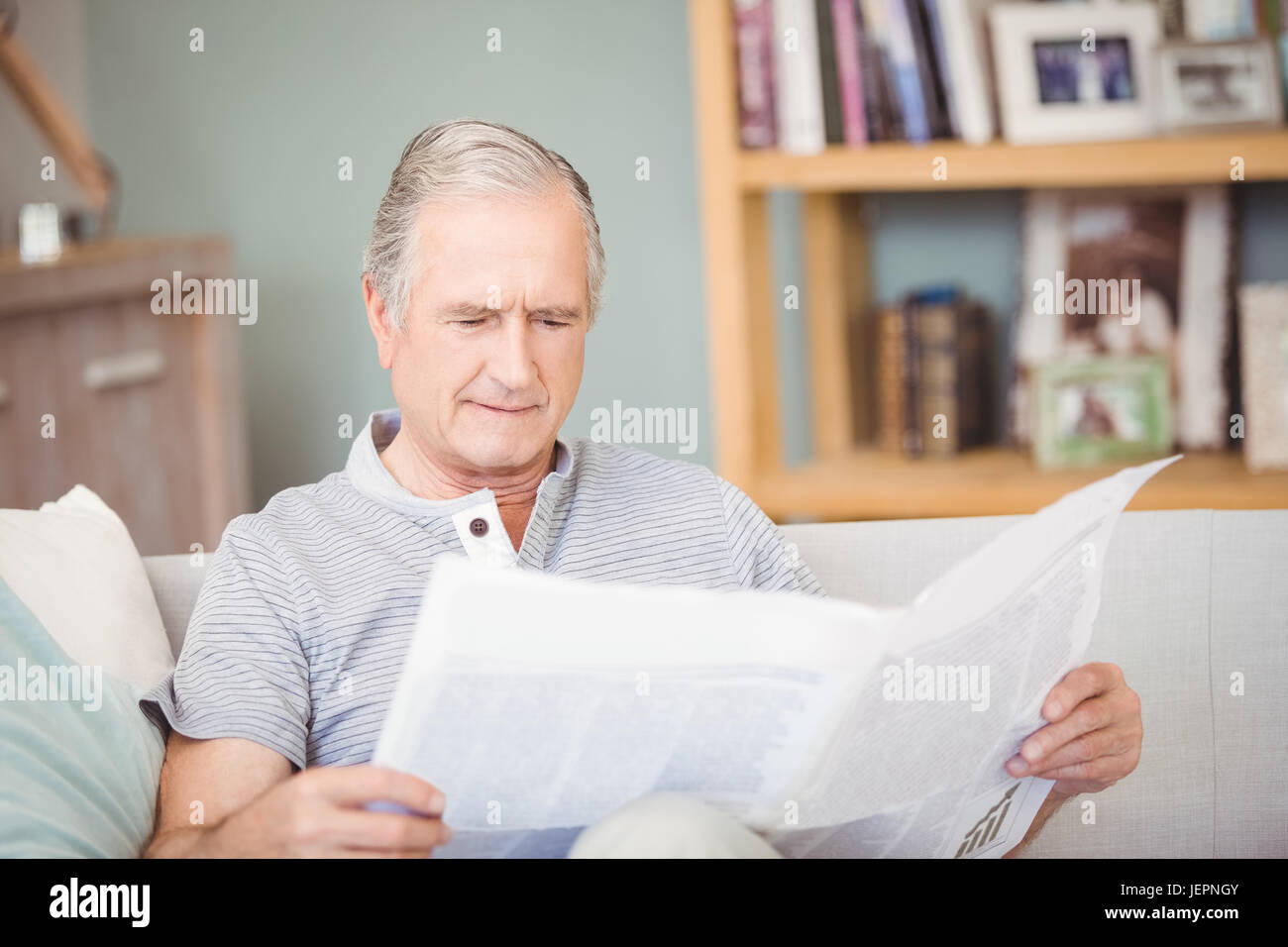 Senior man reading newspaper Stock Photo - Alamy