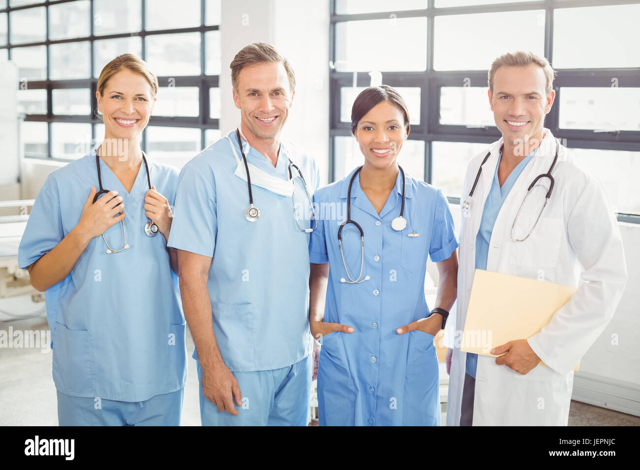 Smiling medical team standing together hi-res stock photography and ...