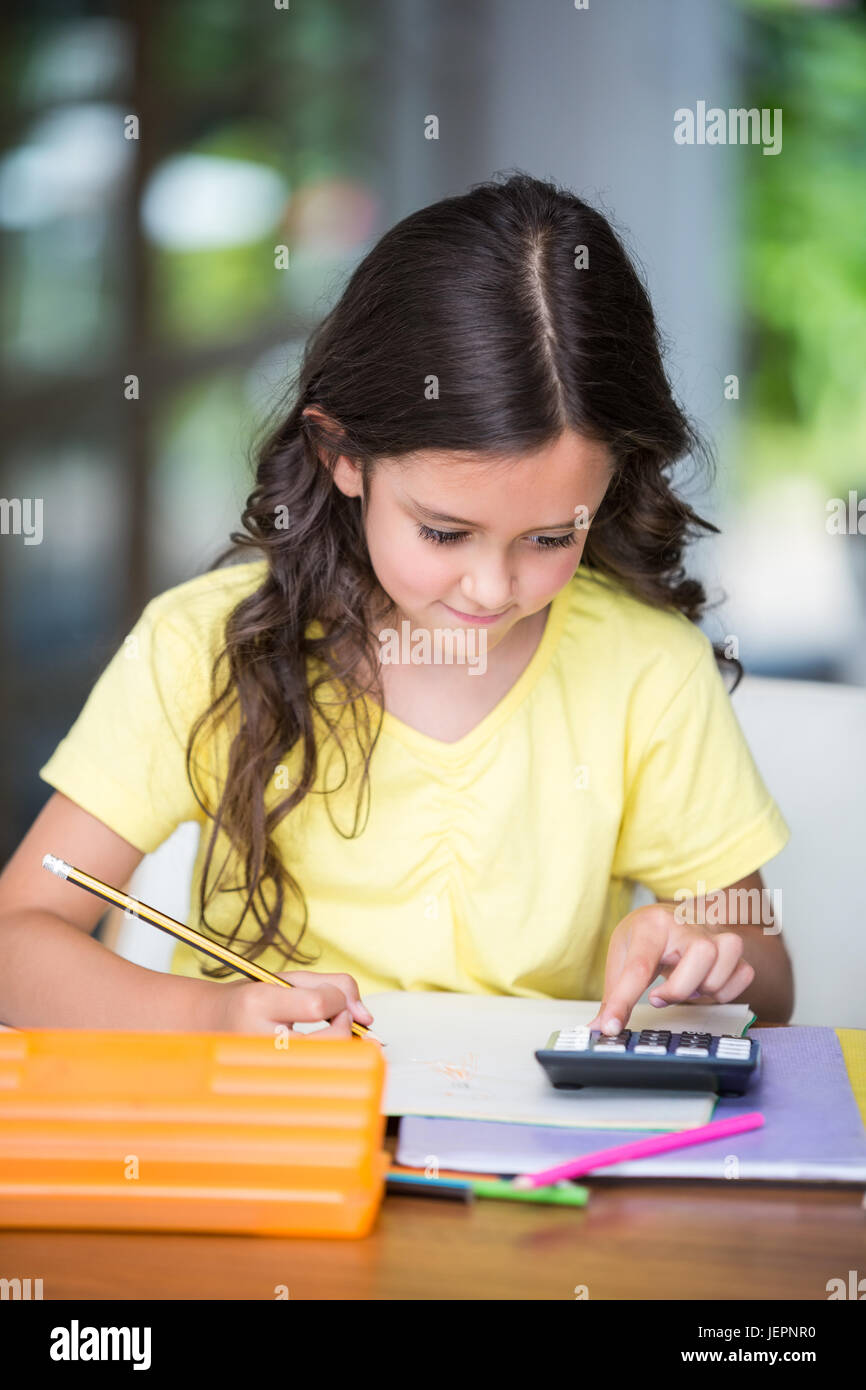 Girl doing math homework Stock Photo - Alamy