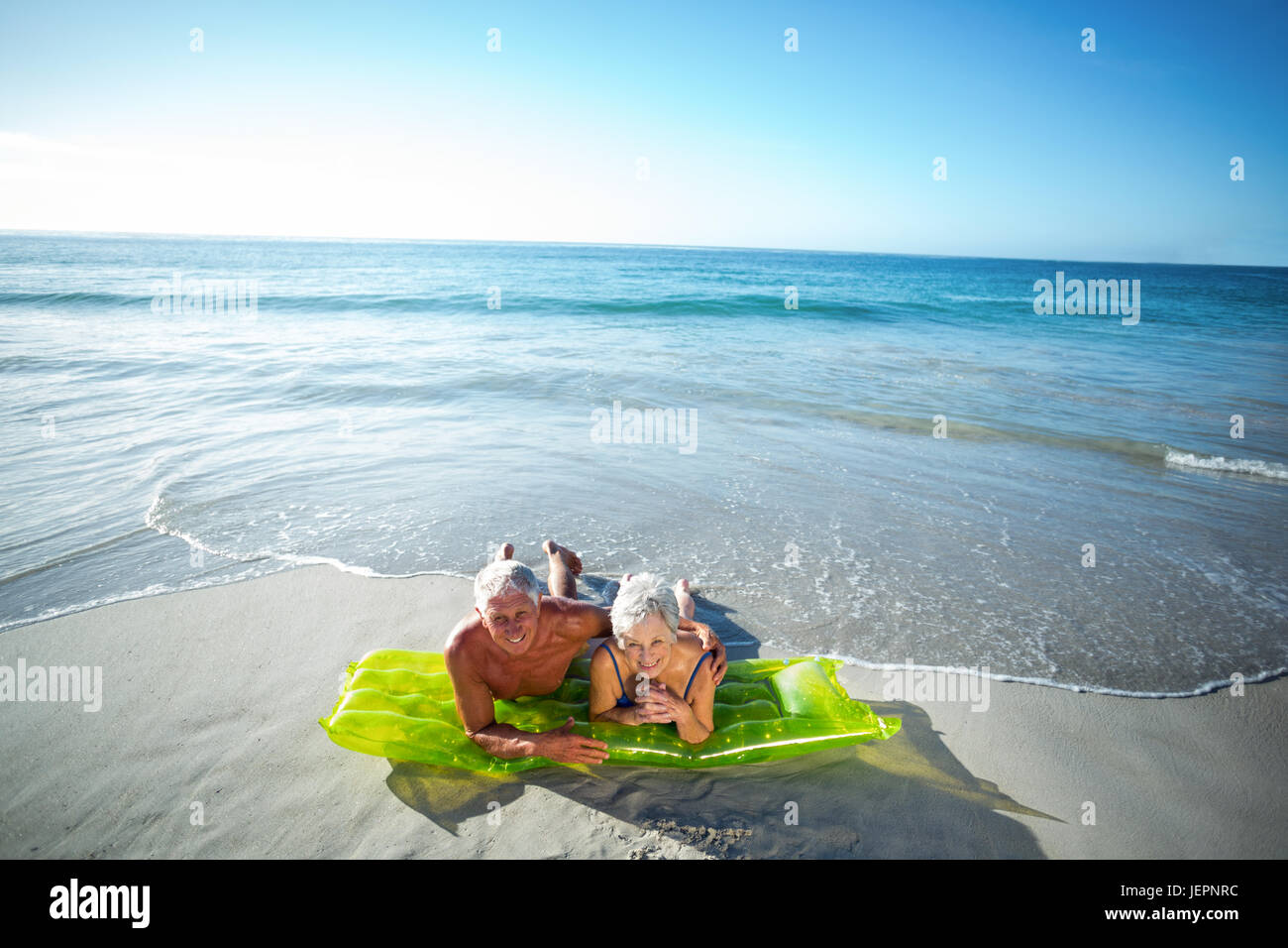 Woman lying on bed on beach hi-res stock photography and images - Alamy