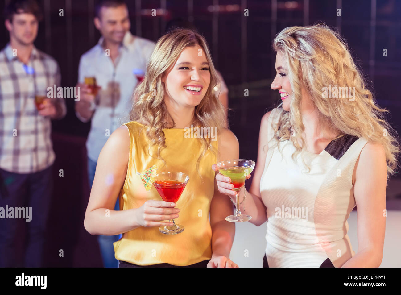 Pretty girls with cocktails Stock Photo - Alamy