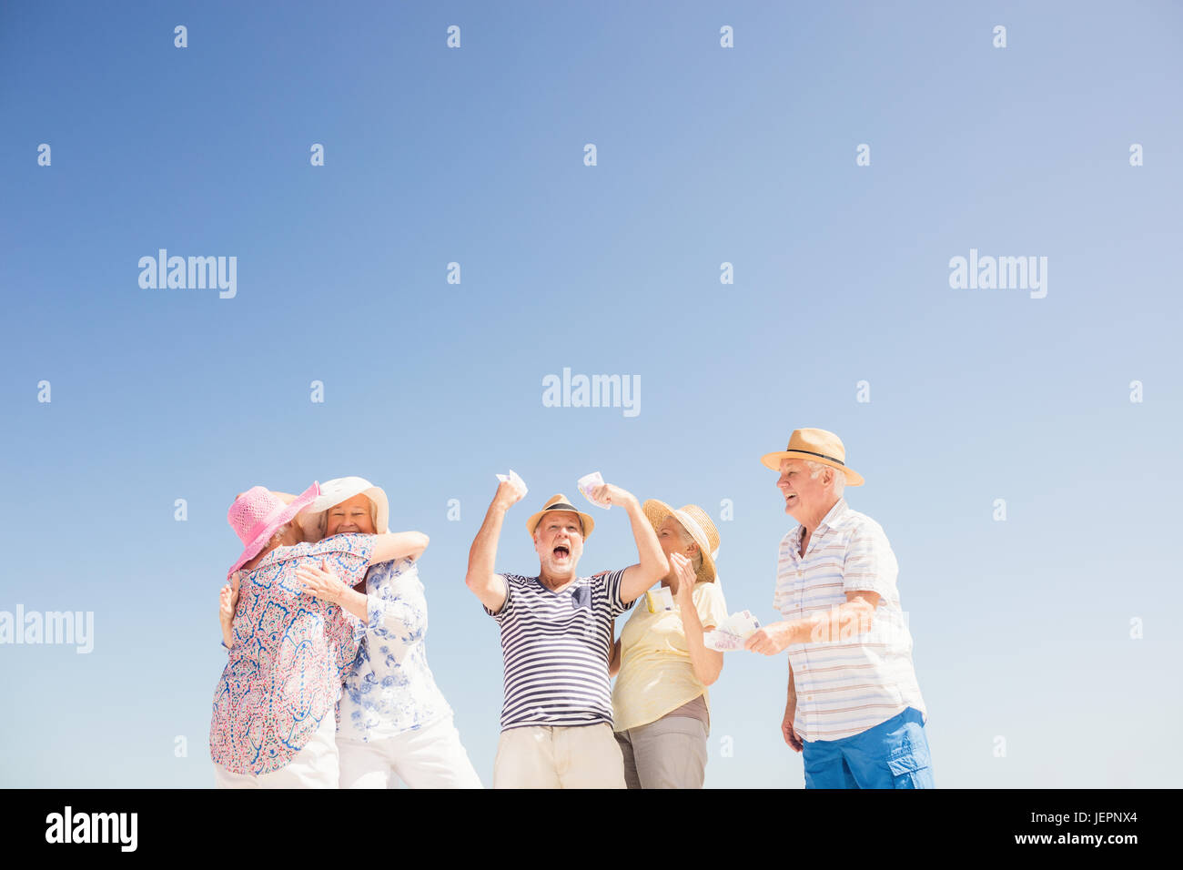 Happy senior holding money Stock Photo - Alamy