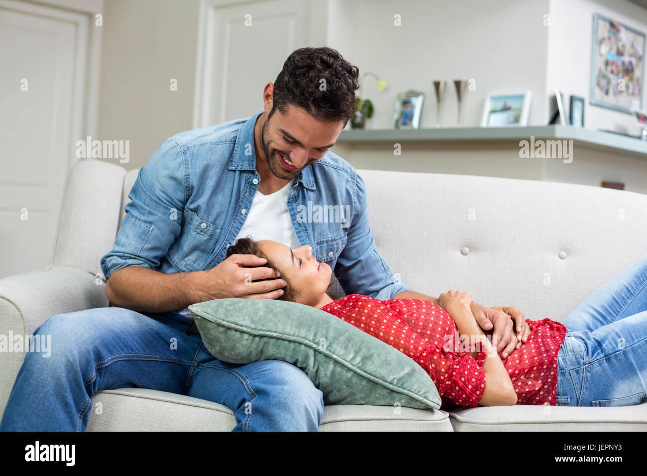 Romantic couple relaxing on sofa hi-res stock photography and images ...