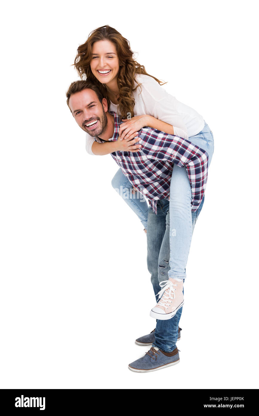 Man giving piggyback ride to woman Stock Photo - Alamy