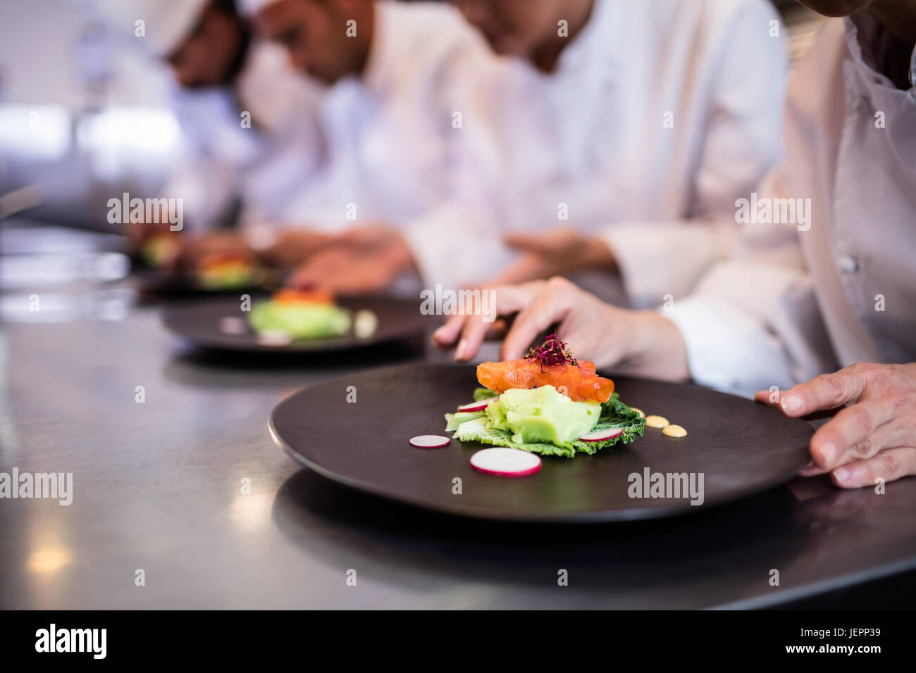 Close up woman decorating plate hi-res stock photography and images - Alamy