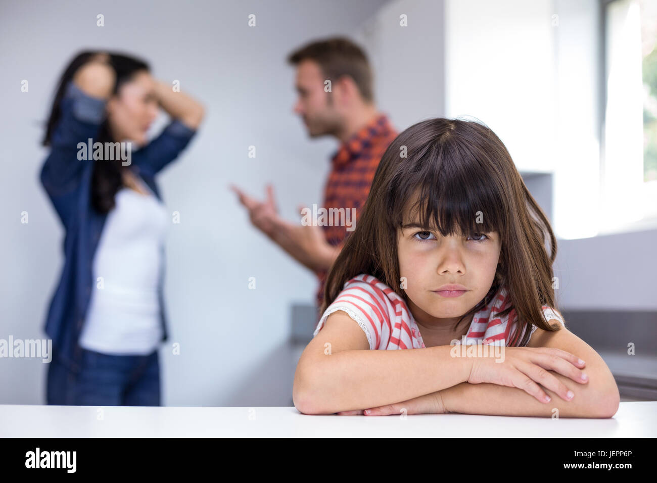 Sad girl hearing parents arguing hi-res stock photography and images ...