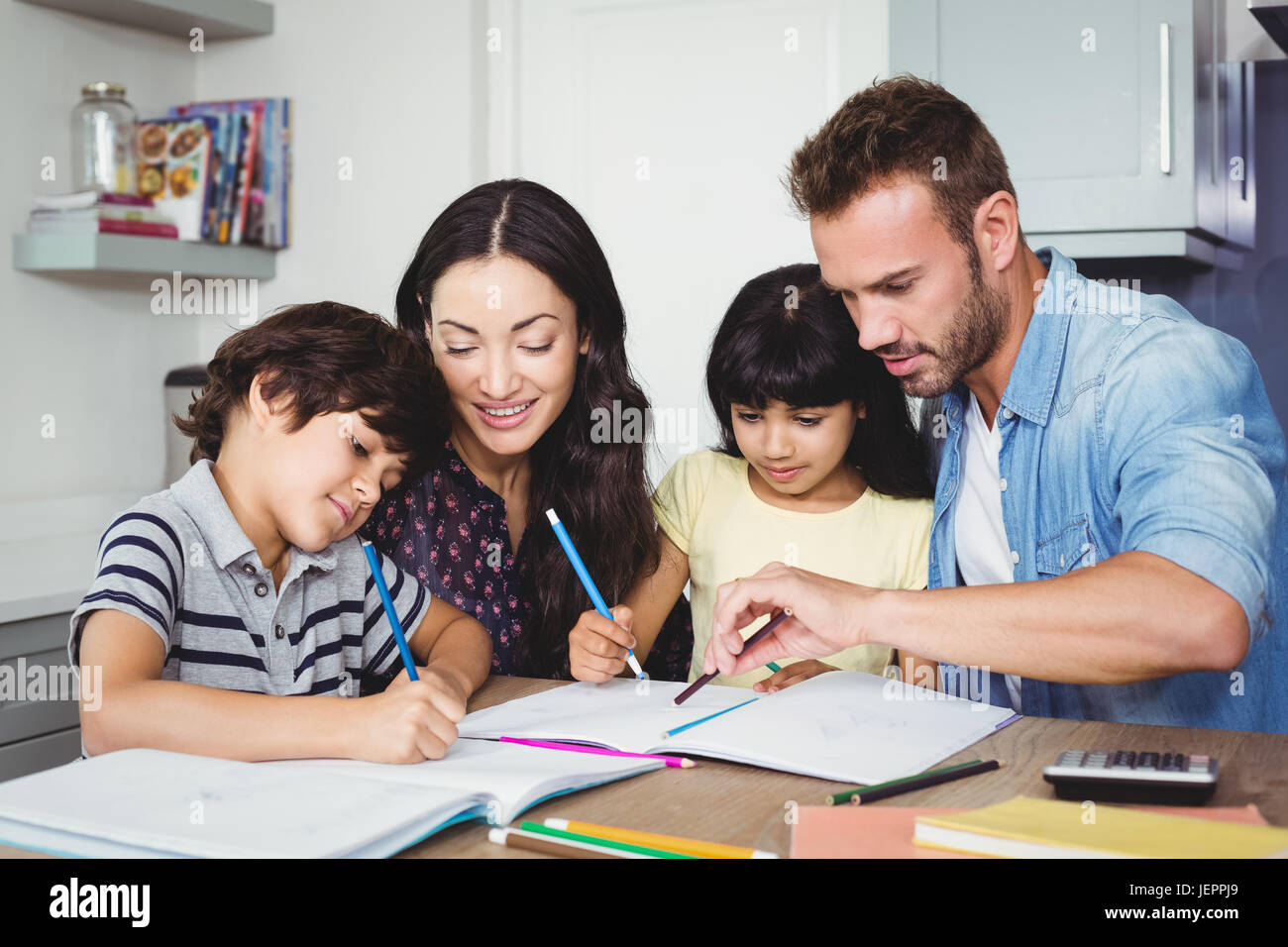 Child assisting parents hi-res stock photography and images - Alamy
