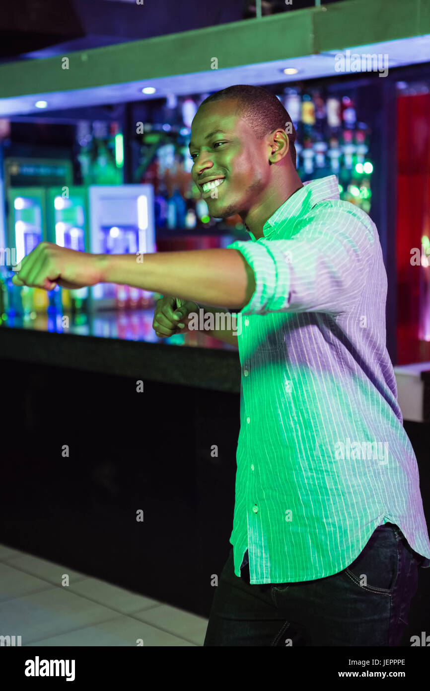 Young man dancing in nightclub hi-res stock photography and images - Alamy