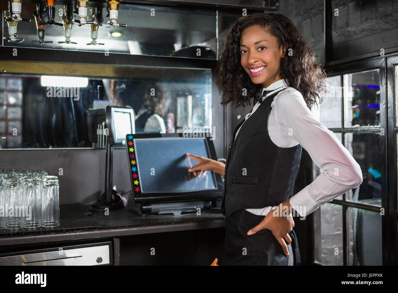 Happy barmaid preparing a bill Stock Photo - Alamy