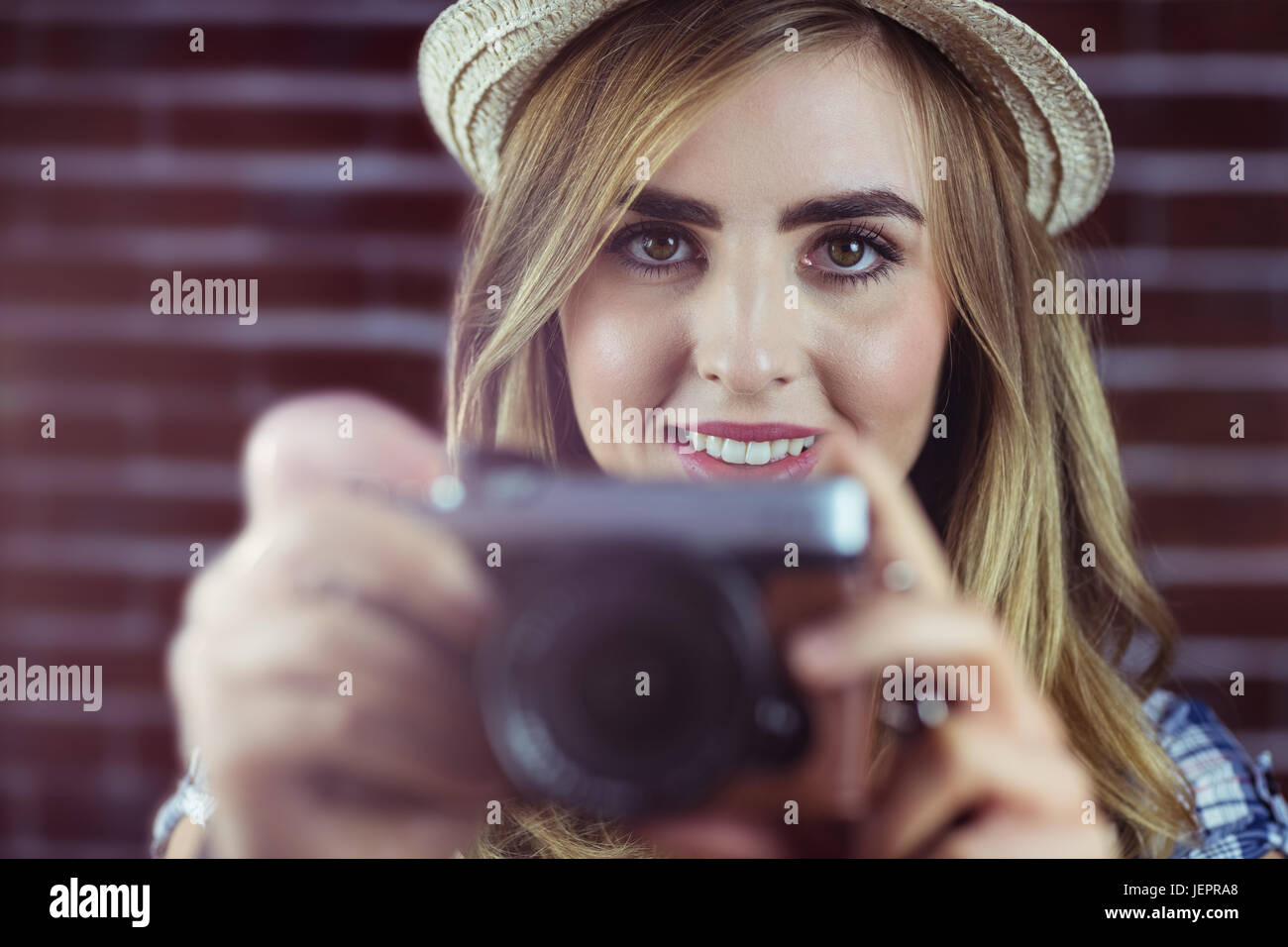 Blonde woman taking pictures digital hi-res stock photography and ...