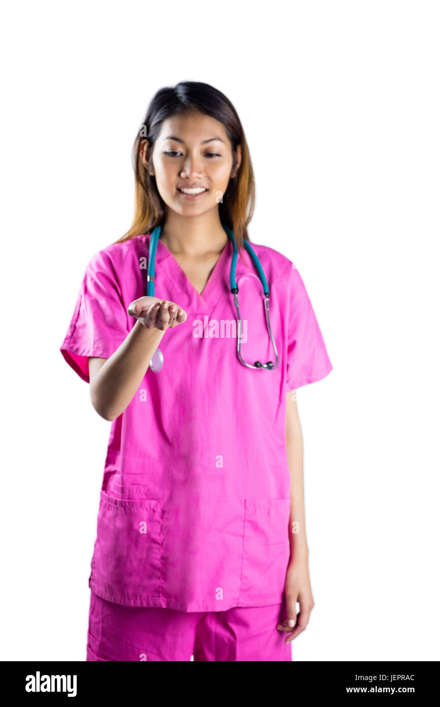 Asian nurse stretching out hand Stock Photo - Alamy