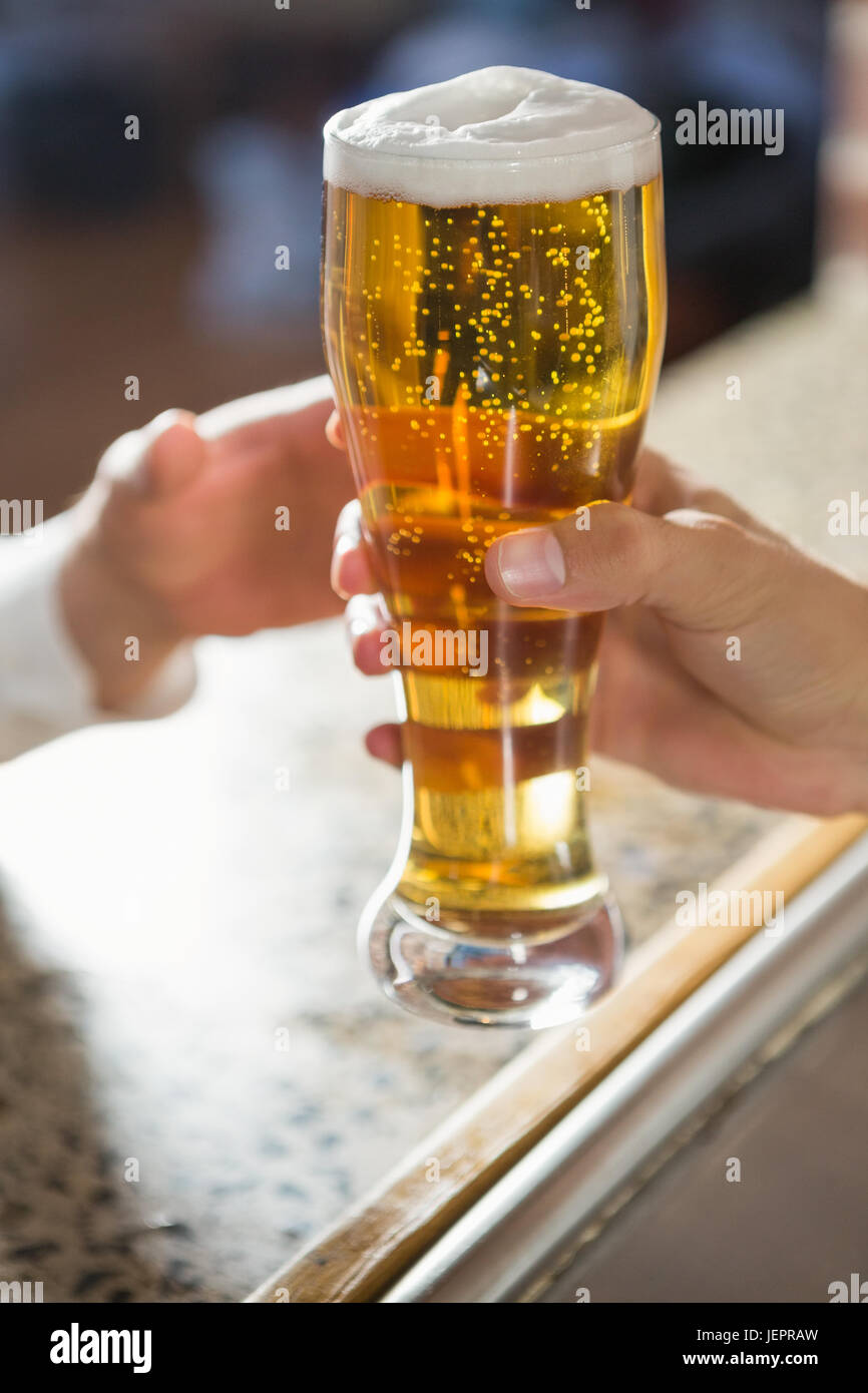 Close up of masculine hands giving a pint Stock Photo - Alamy